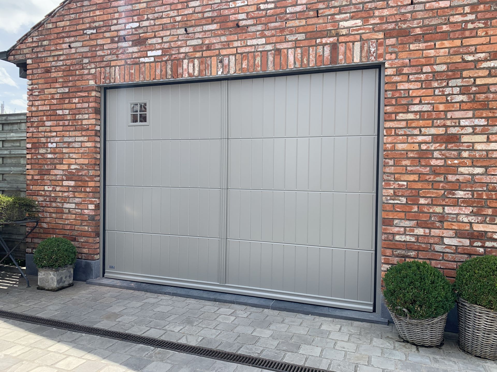 Wat is een sectionale poort en wat kost dat? - Krial